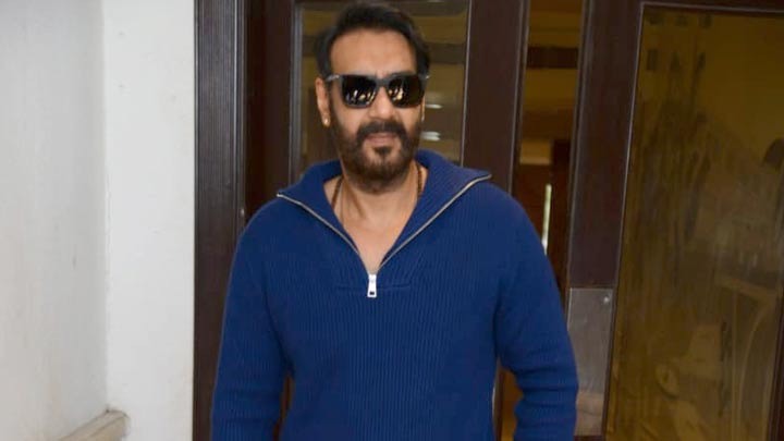 Ajay Devgn poses for paps in a blue hoodie - Bollywood Hungama