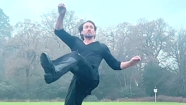 Tiger Shroff uses his powerful kick while playing football in the rain ...