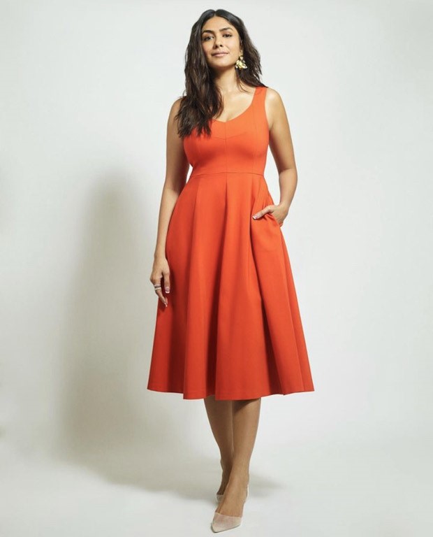 Mrunal Thakur livens up social feed with her vibrant orange Kate Spade ...